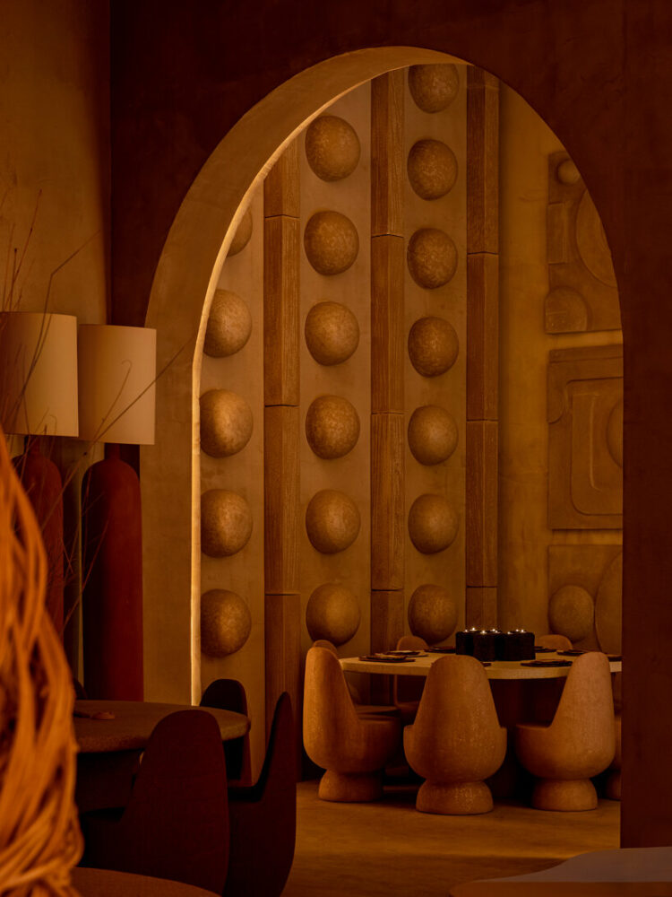 natural textures and earth tones wrap each surface of cavernous la nena cafe in dubai | ARCHCOD