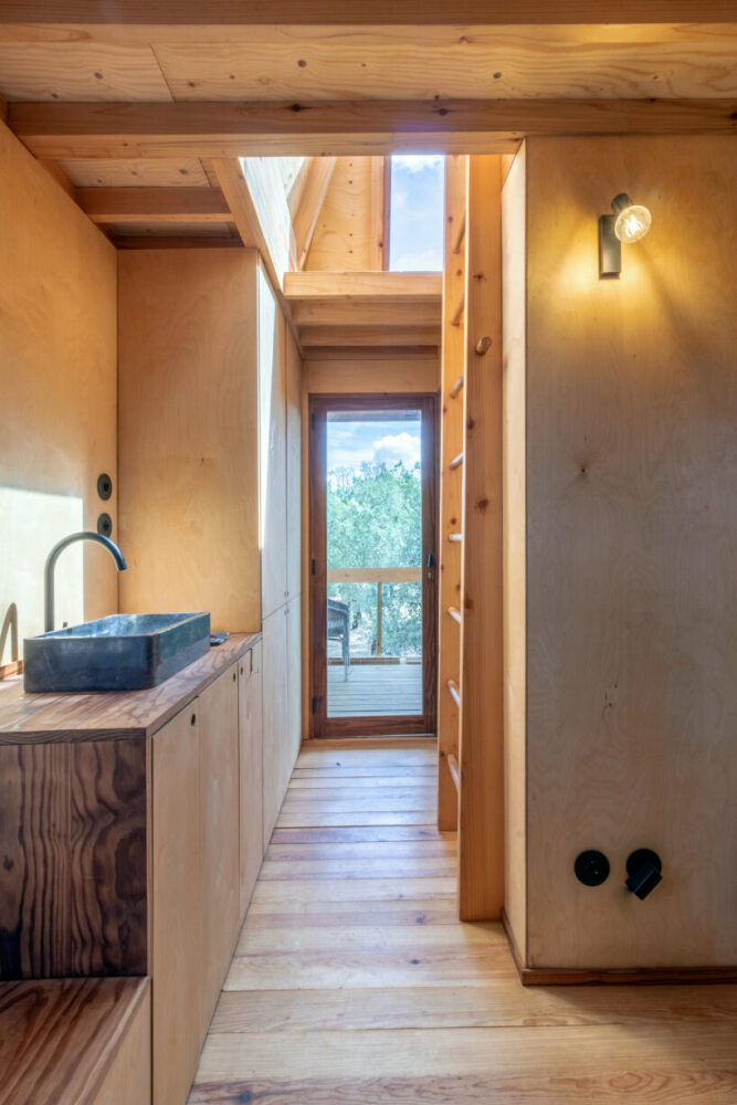 madeiguincho tops wooden shack 'columba' with skylight in sunshine ...