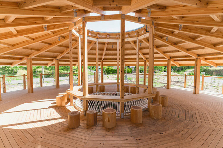 cloud architects weaves circular kiosk into the lush mountainous ...