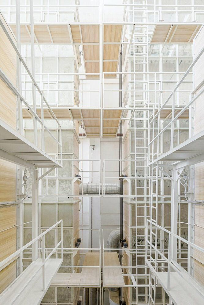 greater dog architects adorns mixed-used building with feather-shaped ...