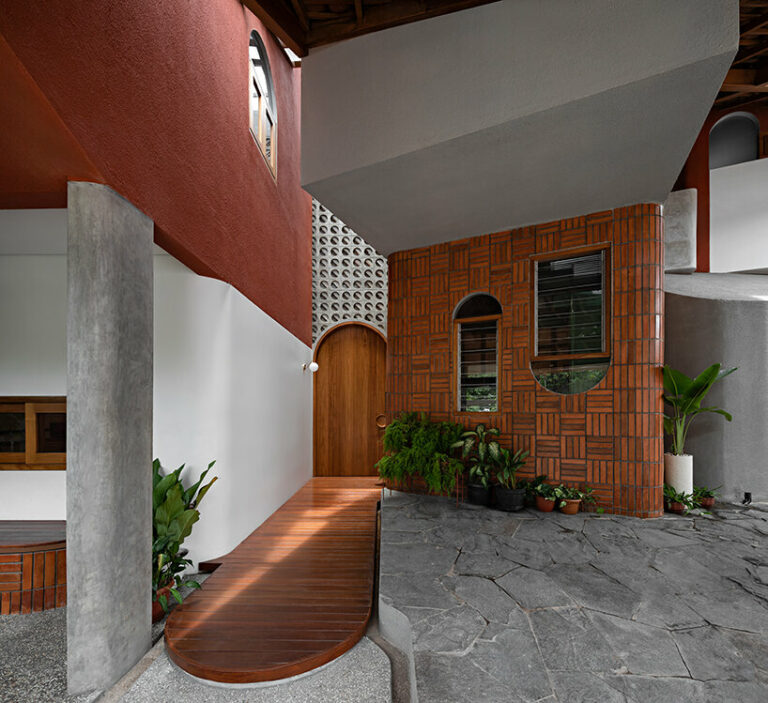 distracted house adorns a quirky roof composition in indonesia