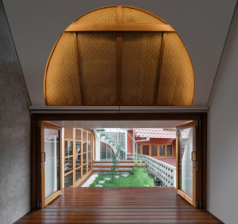 distracted house adorns a quirky roof composition in indonesia