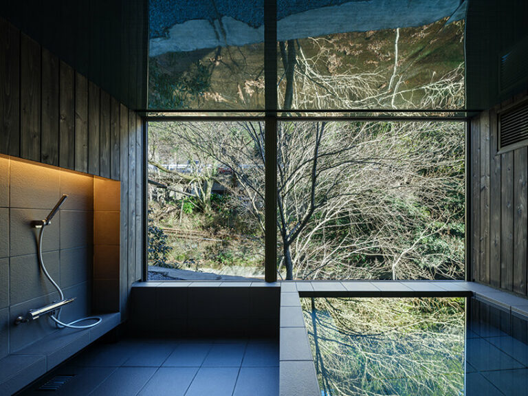kubo tsushima architects reflects river scenery within hotel in japan