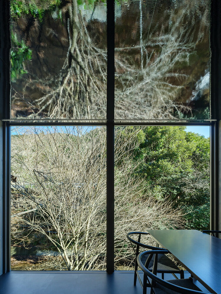 kubo tsushima architects reflects river scenery within hotel in japan