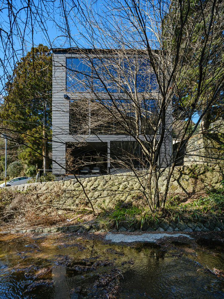 kubo tsushima architects reflects river scenery within hotel in japan