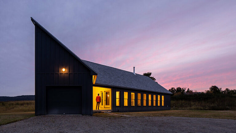 a dramatic yellow void defines 'oblong farm' by scalar architecture