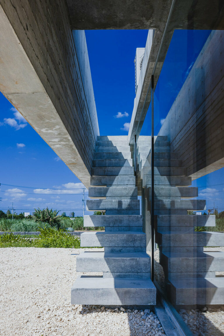 house in japan extends around a single column like an open umbrella