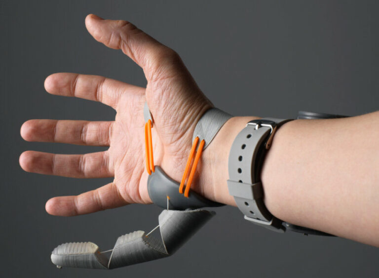 attachable 3D-printed robot thumb grasps objects like a real finger