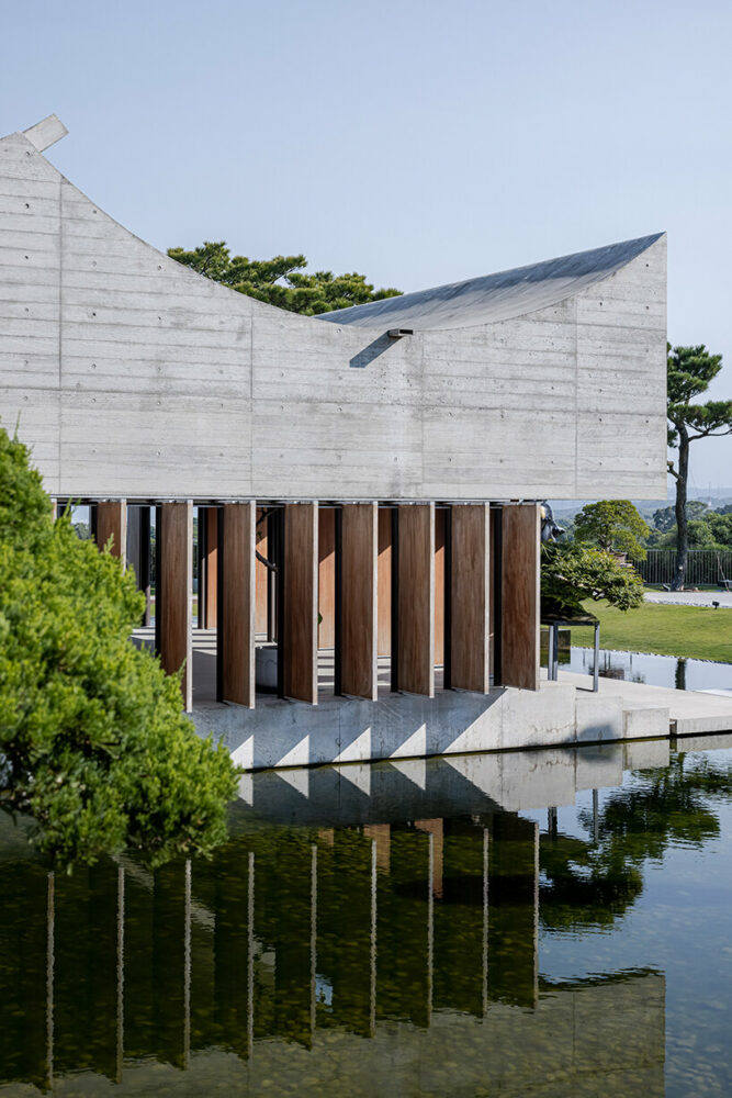 curved concrete plates adorn 'watermoon tea house' in taiwan