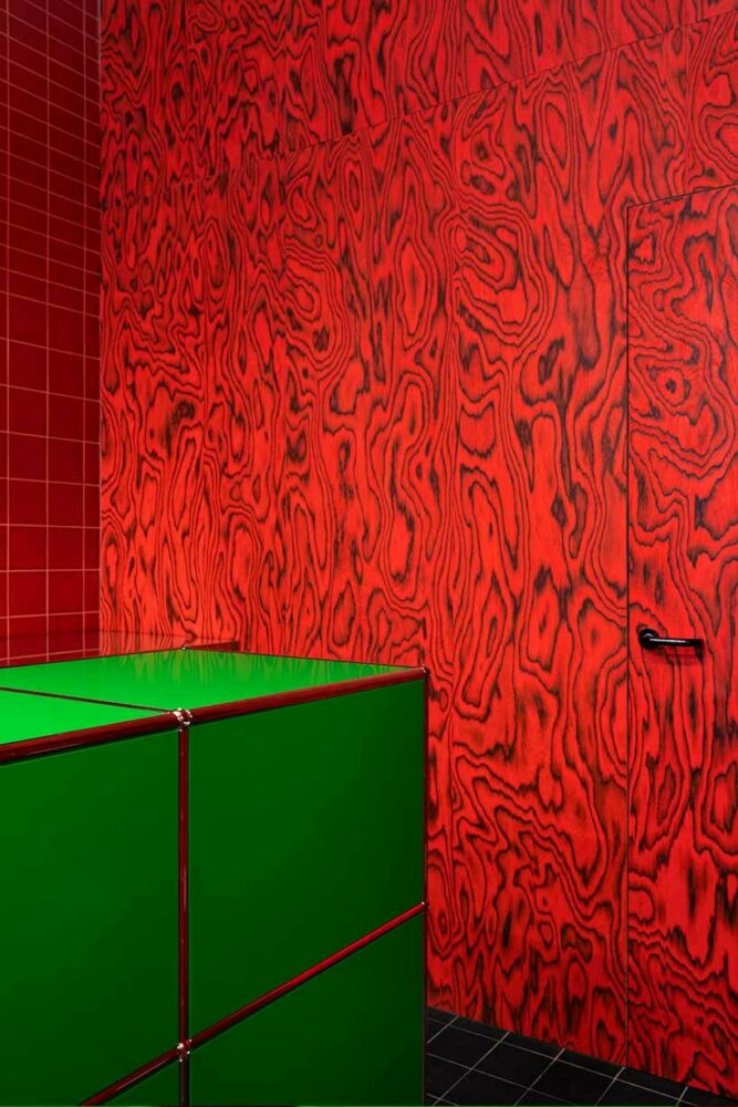 glossy red tiles dynamically contrast with lime green counter within ...