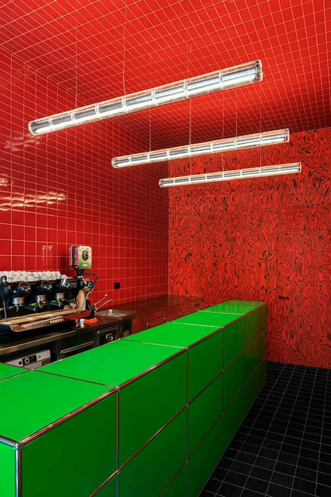 glossy red tiles dynamically contrast with lime green counter within ...