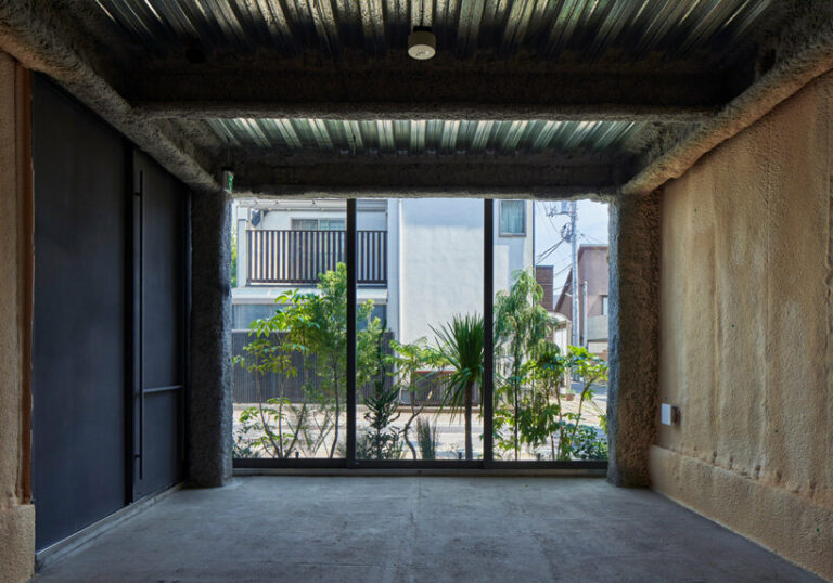 nature-infused path & reflective O_building opens up tokyo street