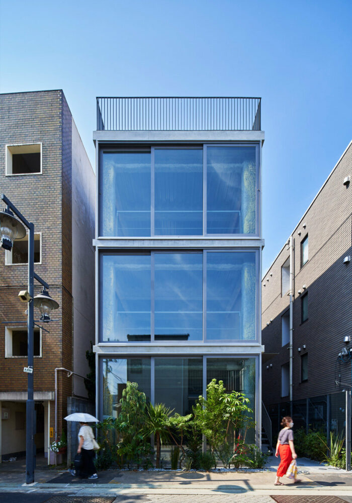 nature-infused path & reflective O_building opens up tokyo street