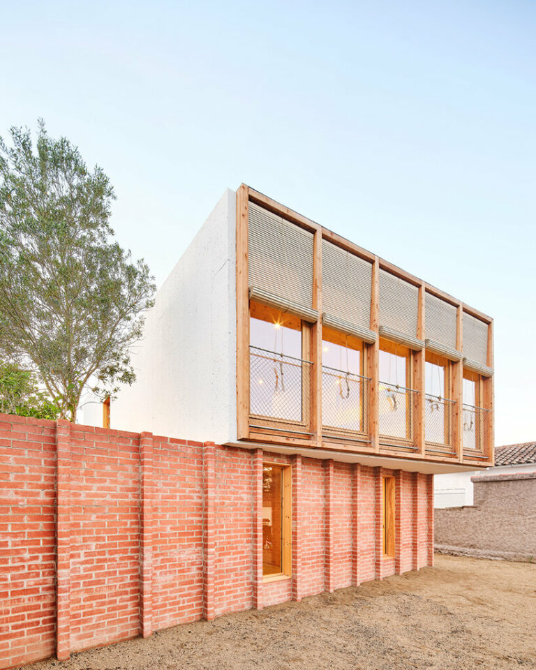 ágora arquitectura stacks CLT house atop old brick base in spain
