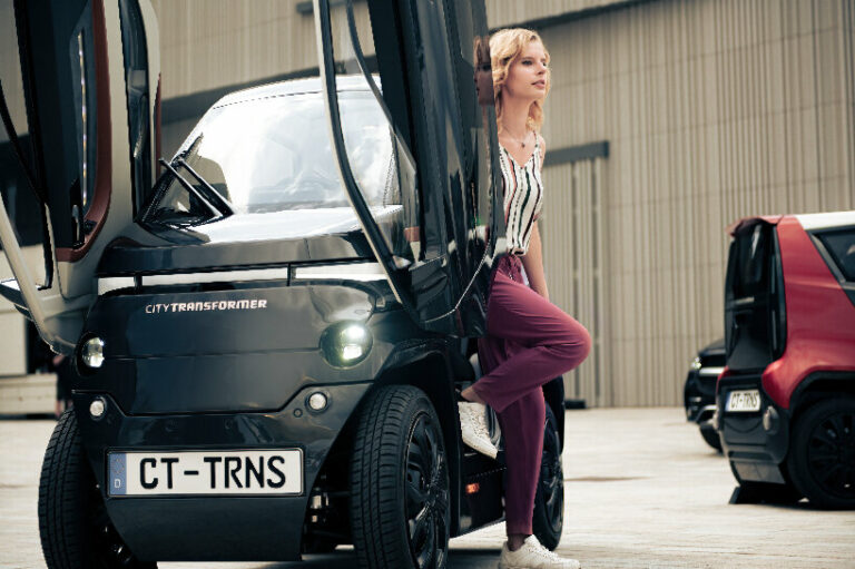 electric microcar retracts wheels to easily park and ride in narrow ...