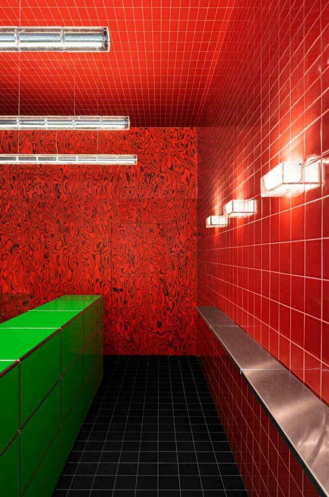 glossy red tiles dynamically contrast with lime green counter within ...