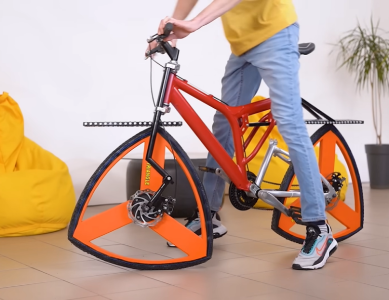 who said wheels have to be round? this triangle-wheeled bike is just as ...