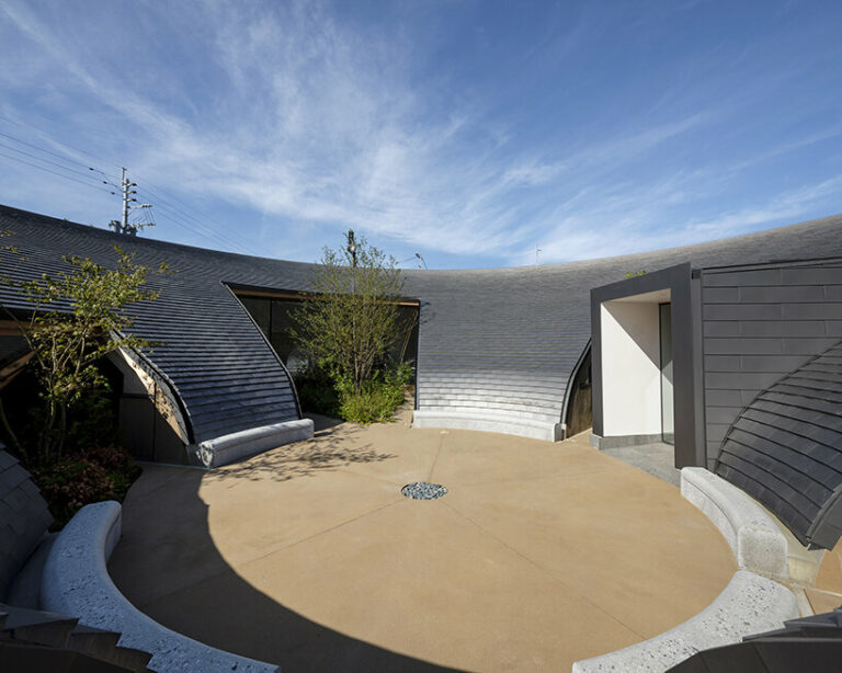 NKS2 architects crowns 'sky vessel house' with inward-curved roof