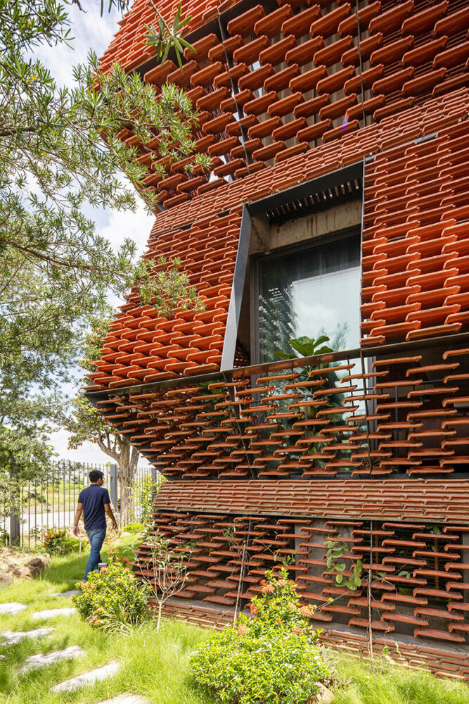 'tile nest' unveiled as a nature-infused porous dwelling in vietnam