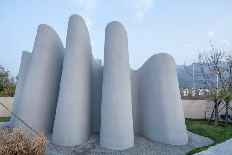 PAO's public restroom meanders around amoeba-shaped concrete structure ...