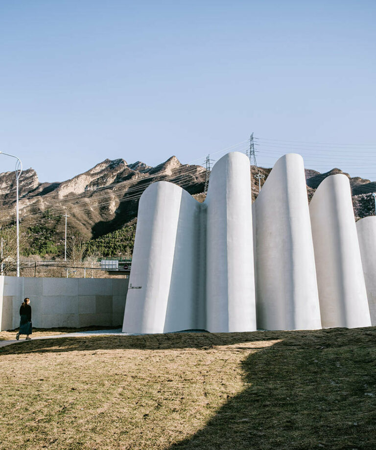 PAO's public restroom meanders around amoeba-shaped concrete structure ...