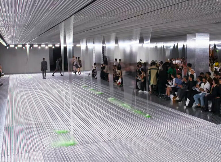 in prada SS24 ‘fluid form’ show, translucent thick slime cascades like luminous resin waterfall