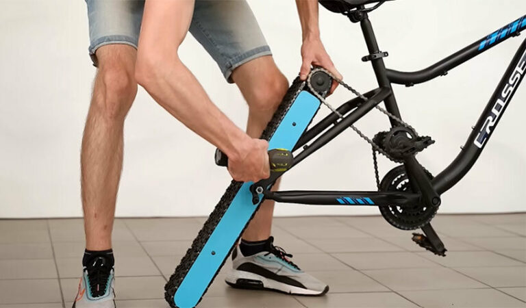 mimicking the mechanics of a tank, engineer builds custom 'wheelless' bike