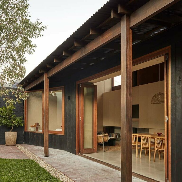 grotto studio's charred timber 'shadow house' extends perth cottage