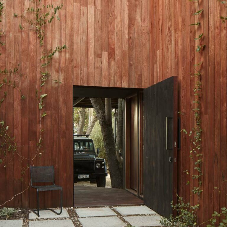 grotto studio's charred timber 'shadow house' extends perth cottage