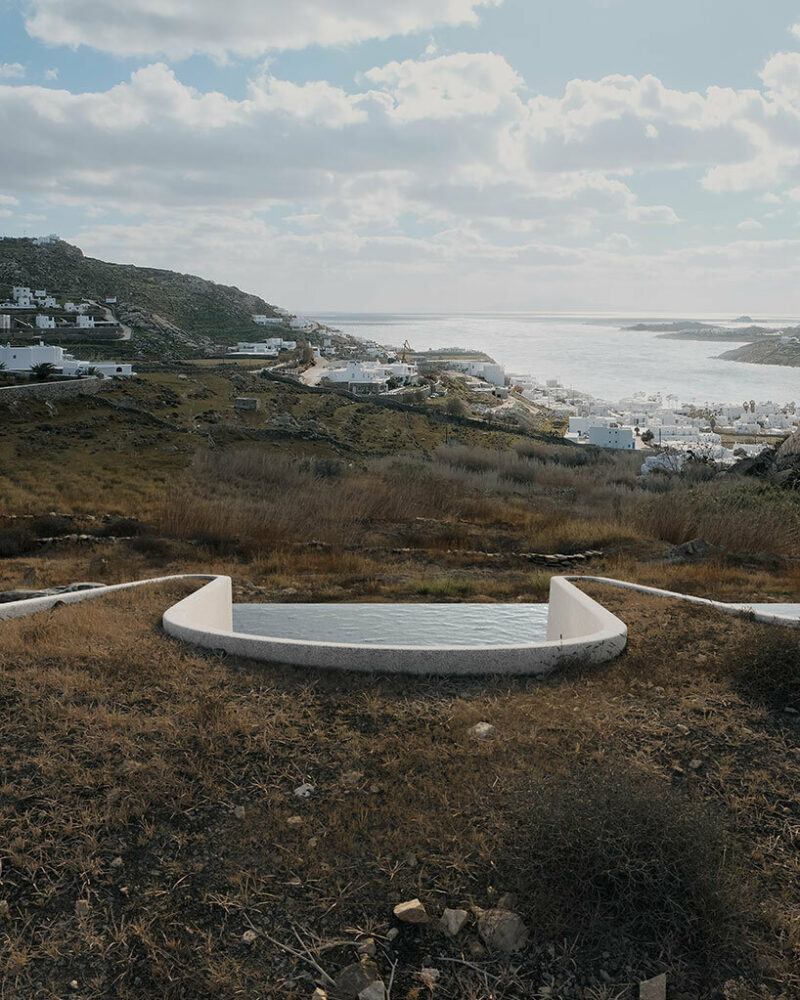 curved line residence by gnb architects emerges from the natural ...