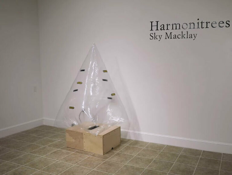 inflatable tree-shaped sculpture by sky macklay plays the harmonica ...