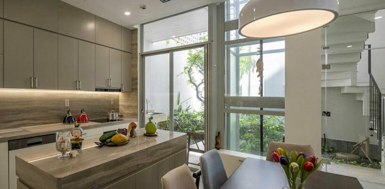 ROOM+ hides 'secret garden' inside sunlit townhouse in vietnam