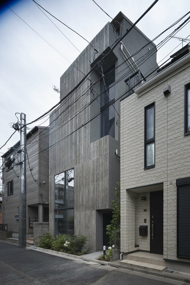 K+S architects fronts home-office with striated concrete texture