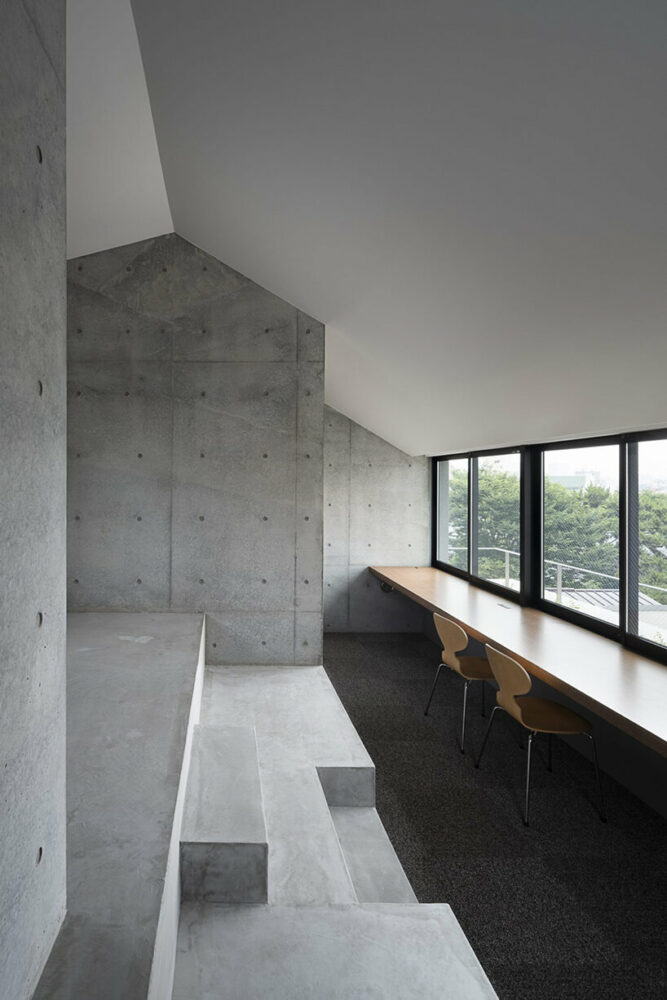 K+S architects fronts home-office with striated concrete texture