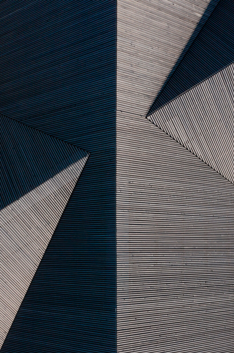 two intersecting saddle roofs shield DMAA's house f in slovenia