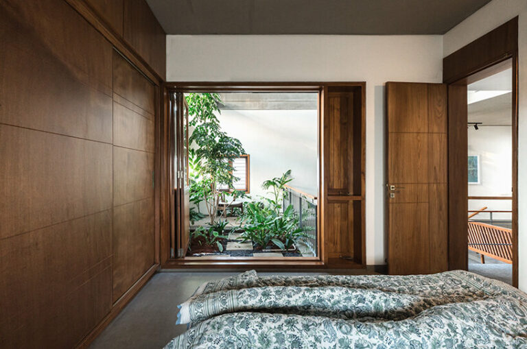 a threshold's green-filled 'ineffable light' house in bangalore