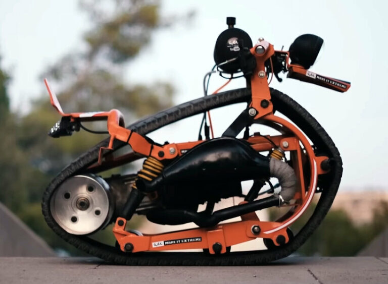 mini motorbike with single recycled car tire around its body can lean ...