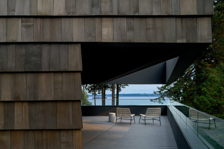 triangular pool juts out from the phoenix house celebrating the ...