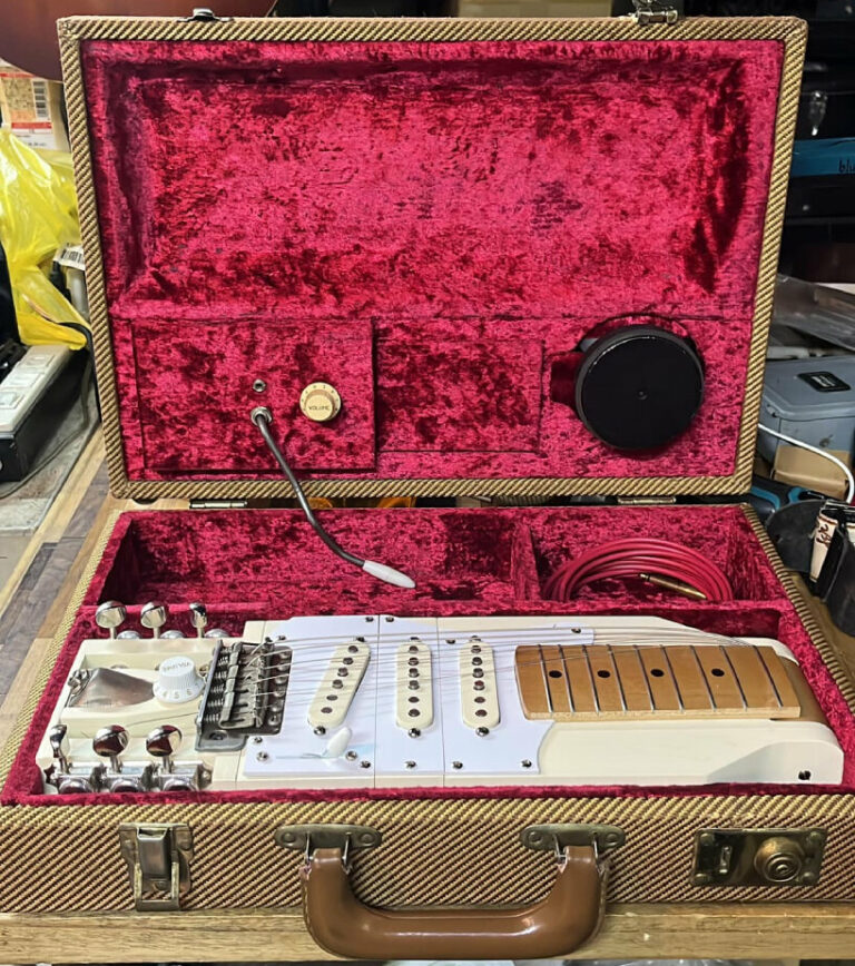 foldable electric guitar for travel fits inside briefcase that has ...