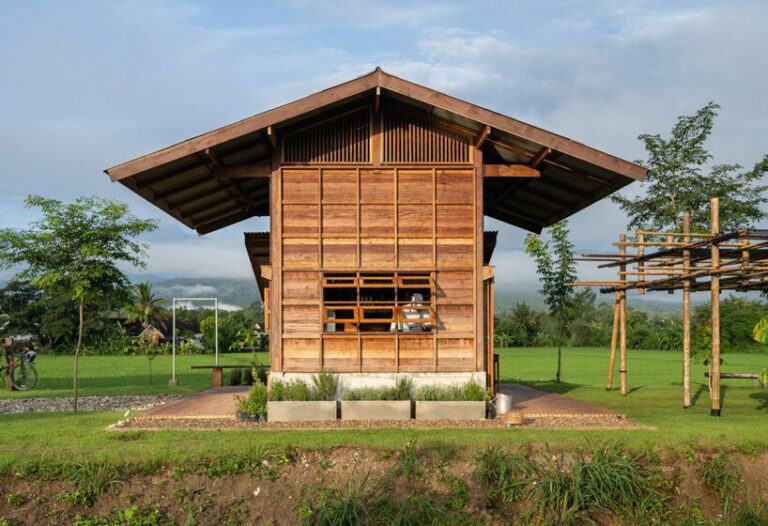 yangnar studio's rice barn-like cafe sits amid paddies in chiang mai