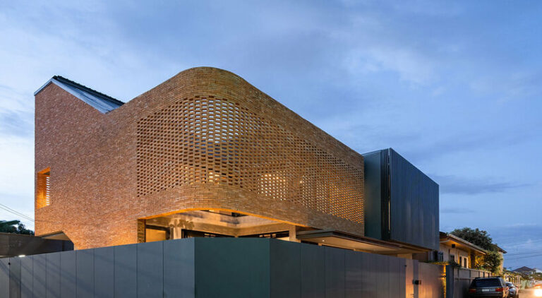 exposed brick wraps residence's facade by bodinchapa in bangkok