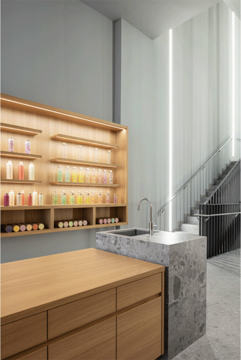 alleswirdgut installs wooden shelf system across shrine-inspired ...