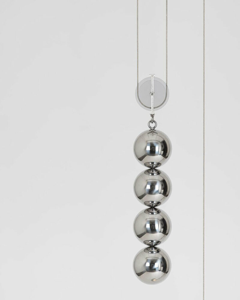 jaewoo ahn suspends blown glass and pendulums in equilibrium