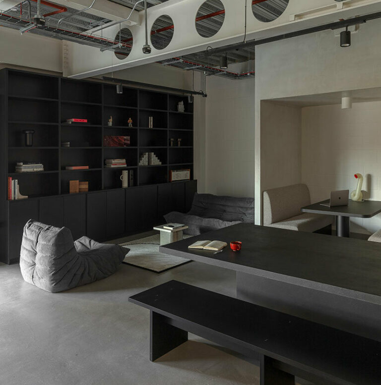 holloway li weaves sculptural steel staircase into monolithic workspace in the UK