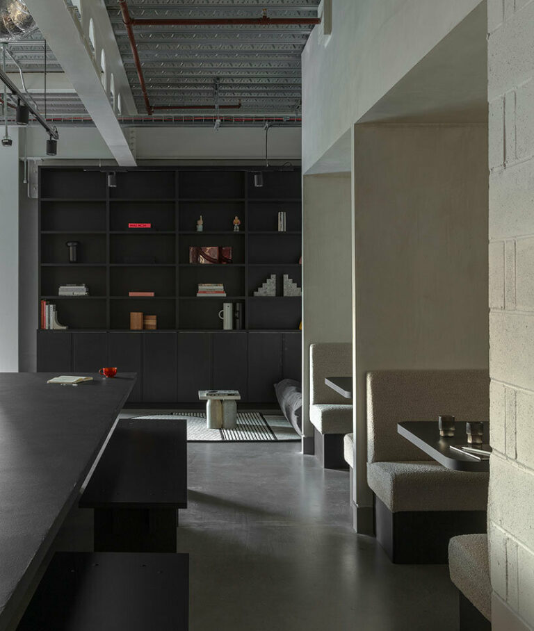 holloway li weaves sculptural steel staircase into monolithic workspace in the UK