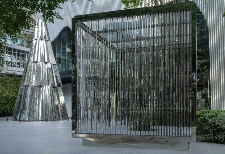 sanitas studio's installations juxtapose mirrors and earth in bangkok