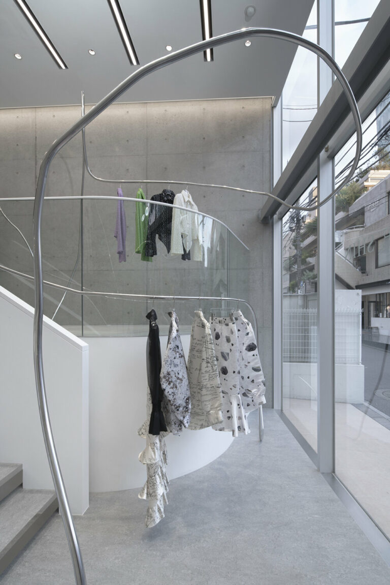 stainless steel tubes curve & flow across mikage shin aoyama store in tokyo