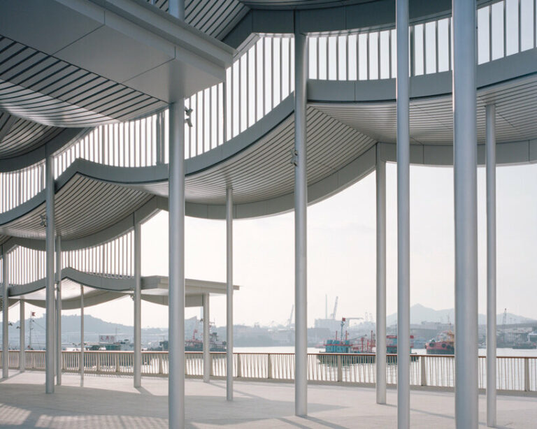 undulating canopy by new office works shelters waterfront promenade in ...