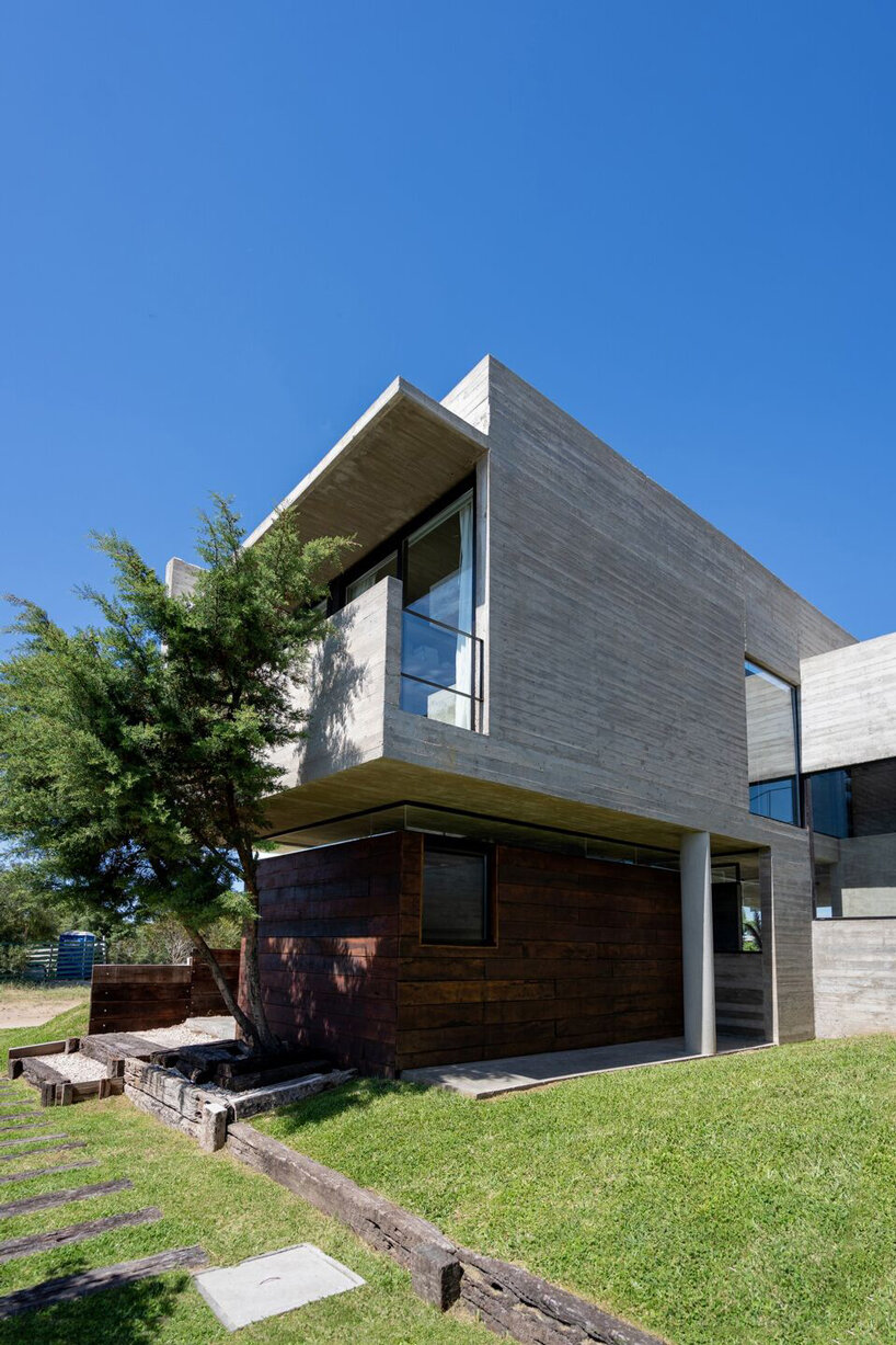 two elevated concrete prisms shape residence in buenos aires