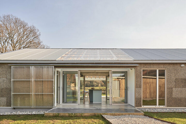a cork and wood house is built by gurea arquitectura cooperativa
